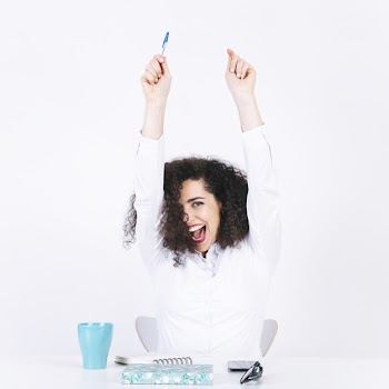 Free: Cheerful Young Woman with Blank Sign - nohat.cc