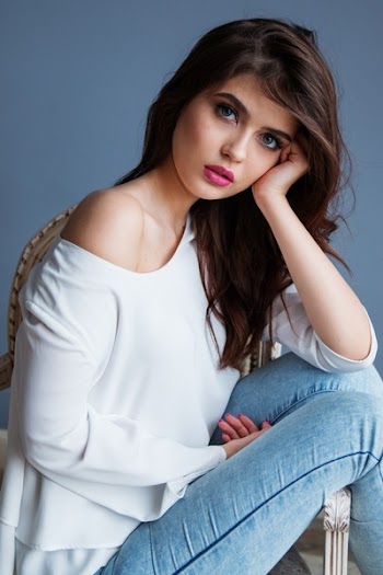 Free: Serene Portrait of a Young Asian Woman in Golden Hour - nohat.cc